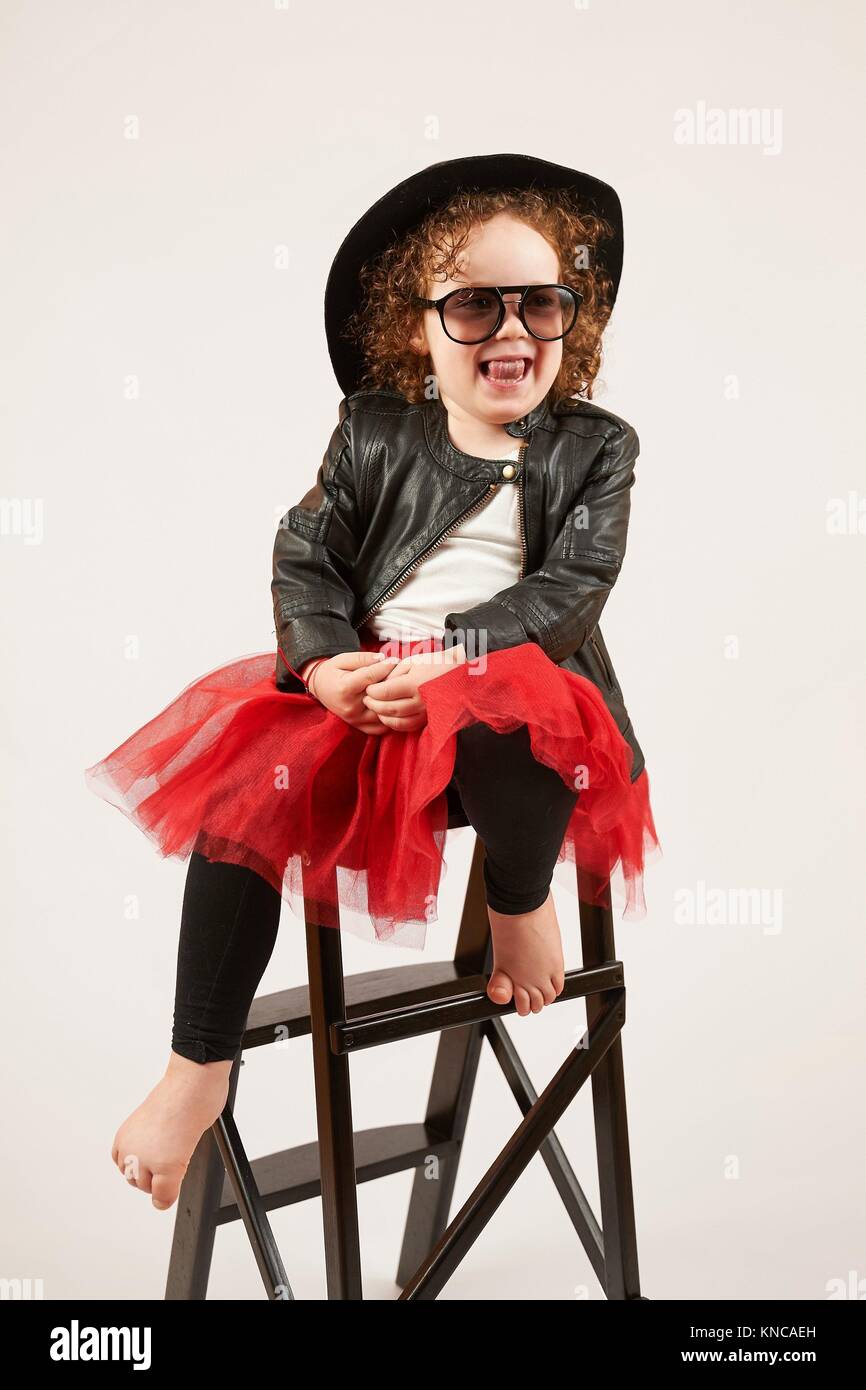Person sitting on a stool hi-res stock photography and images - Alamy