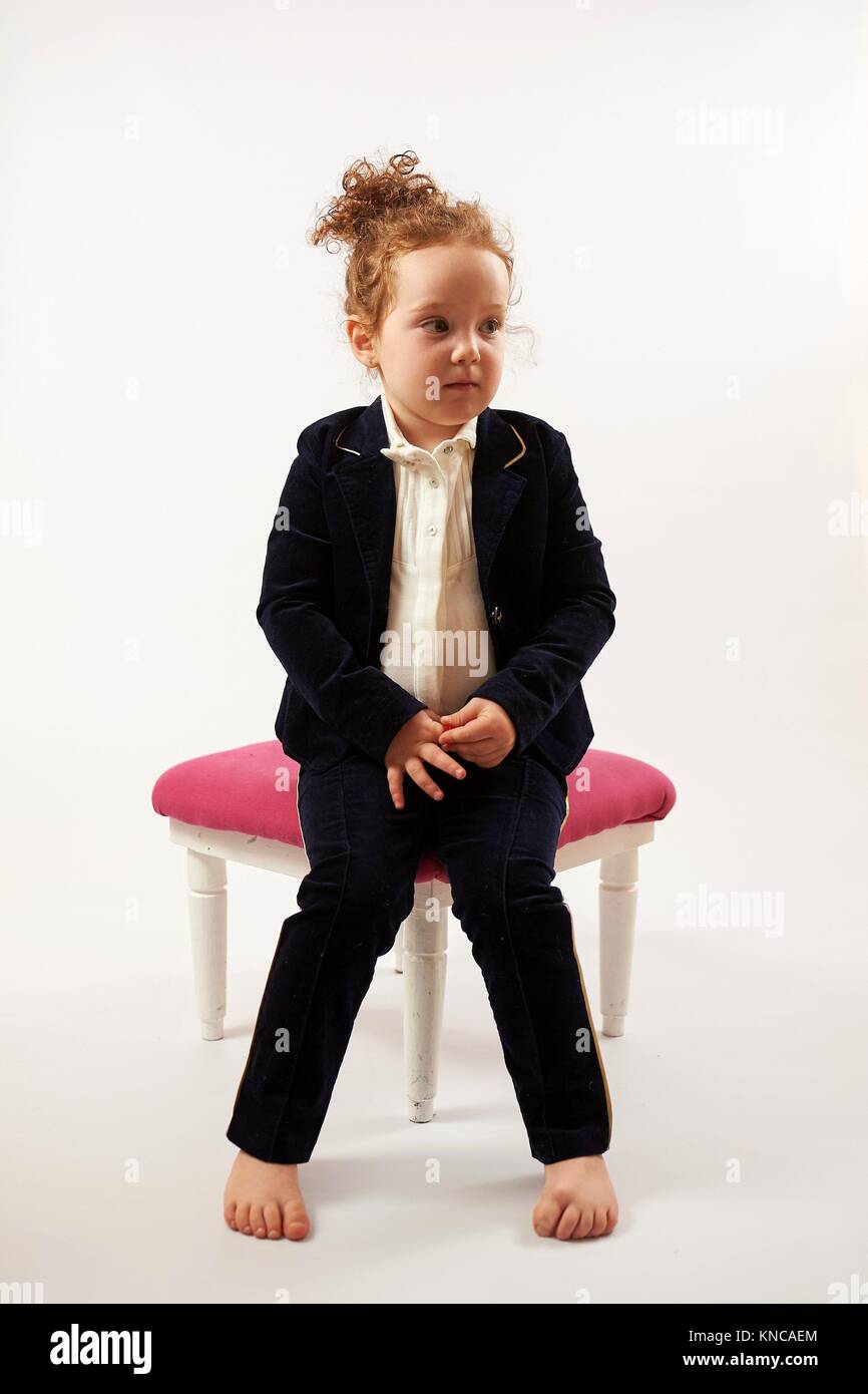 Person sitting on a stool hi-res stock photography and images - Alamy