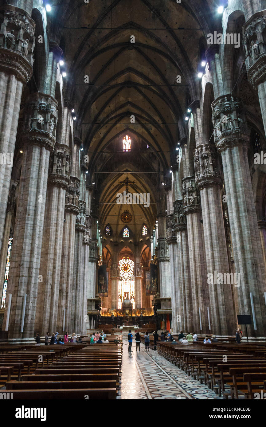 Interior view of central aisle of Milano's Duomo (Italy), with people ...