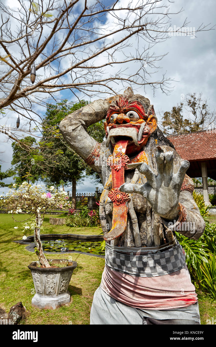 Statue of Rangda, the demon queen, in the Tirta Gangga water palace ...