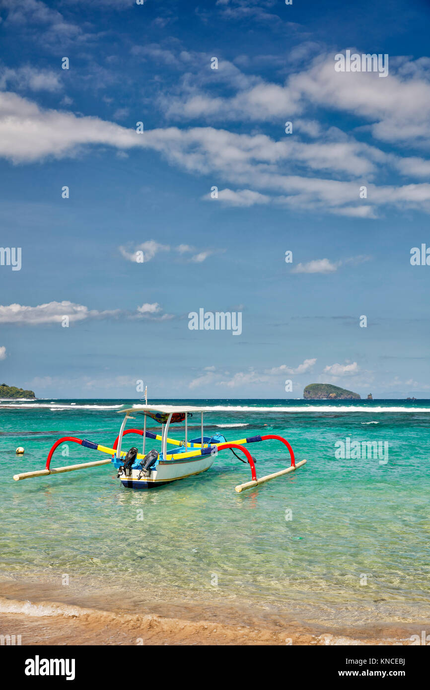 Indonesian outrigger canoe, also known as jukung or cadik moored in ...