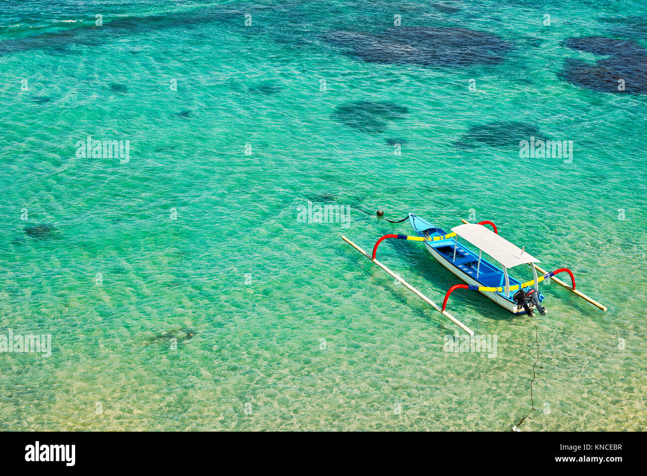 Indonesian outrigger canoe, also known as jukung or cadik moored in ...