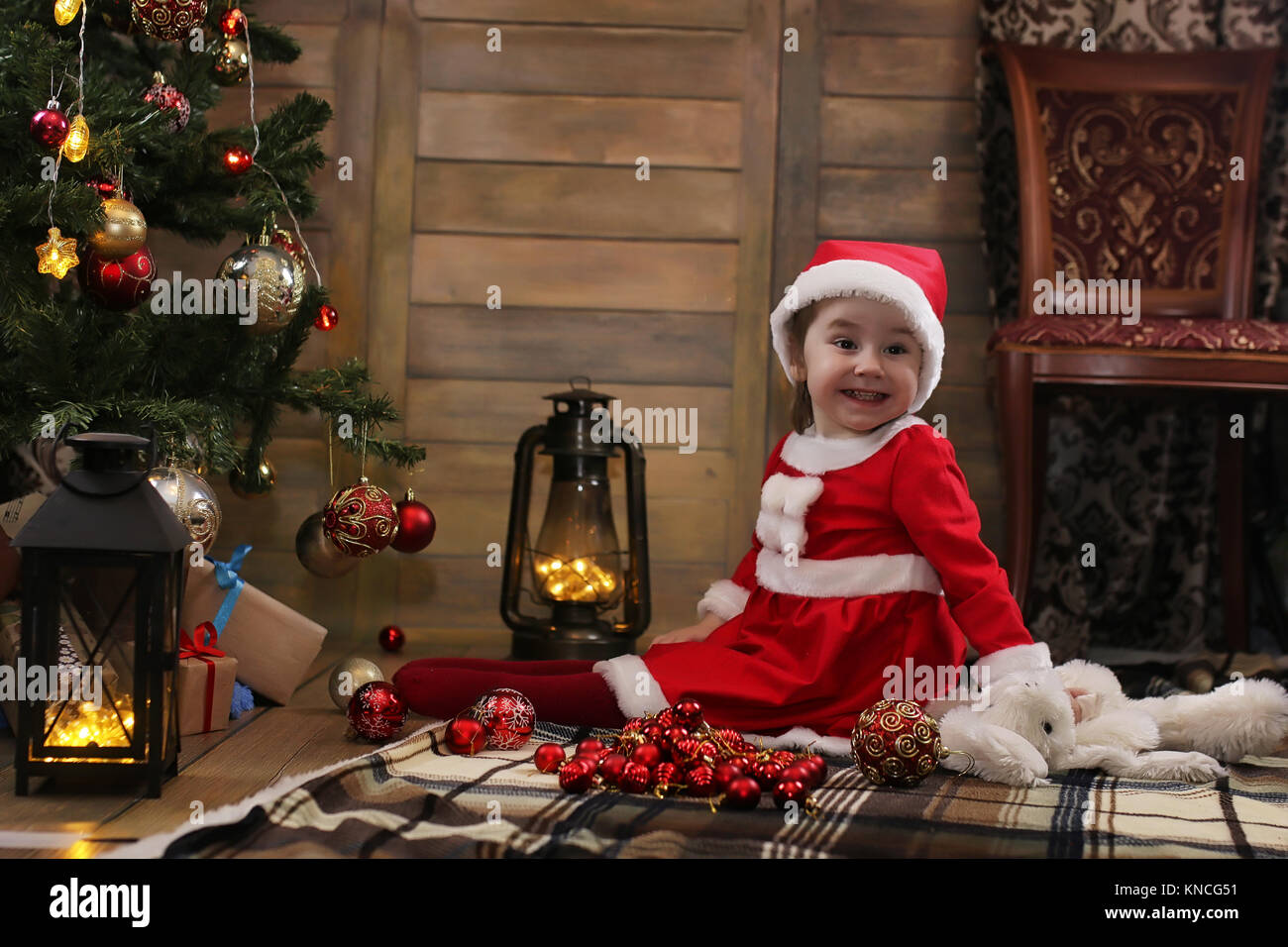 little child and Christmas toys Stock Photo - Alamy