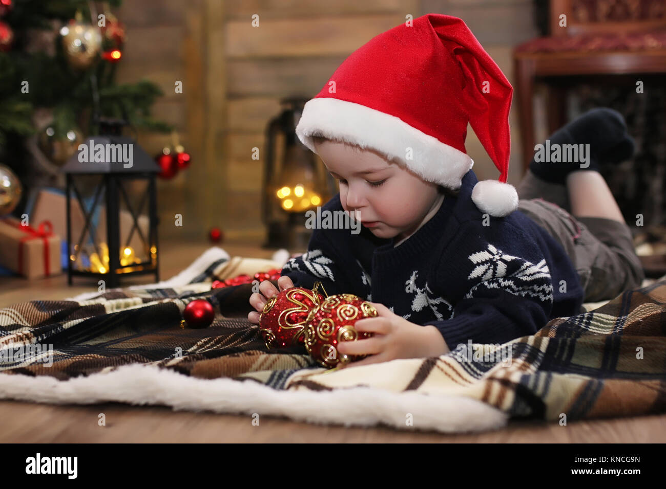 little child and Christmas toys Stock Photo - Alamy