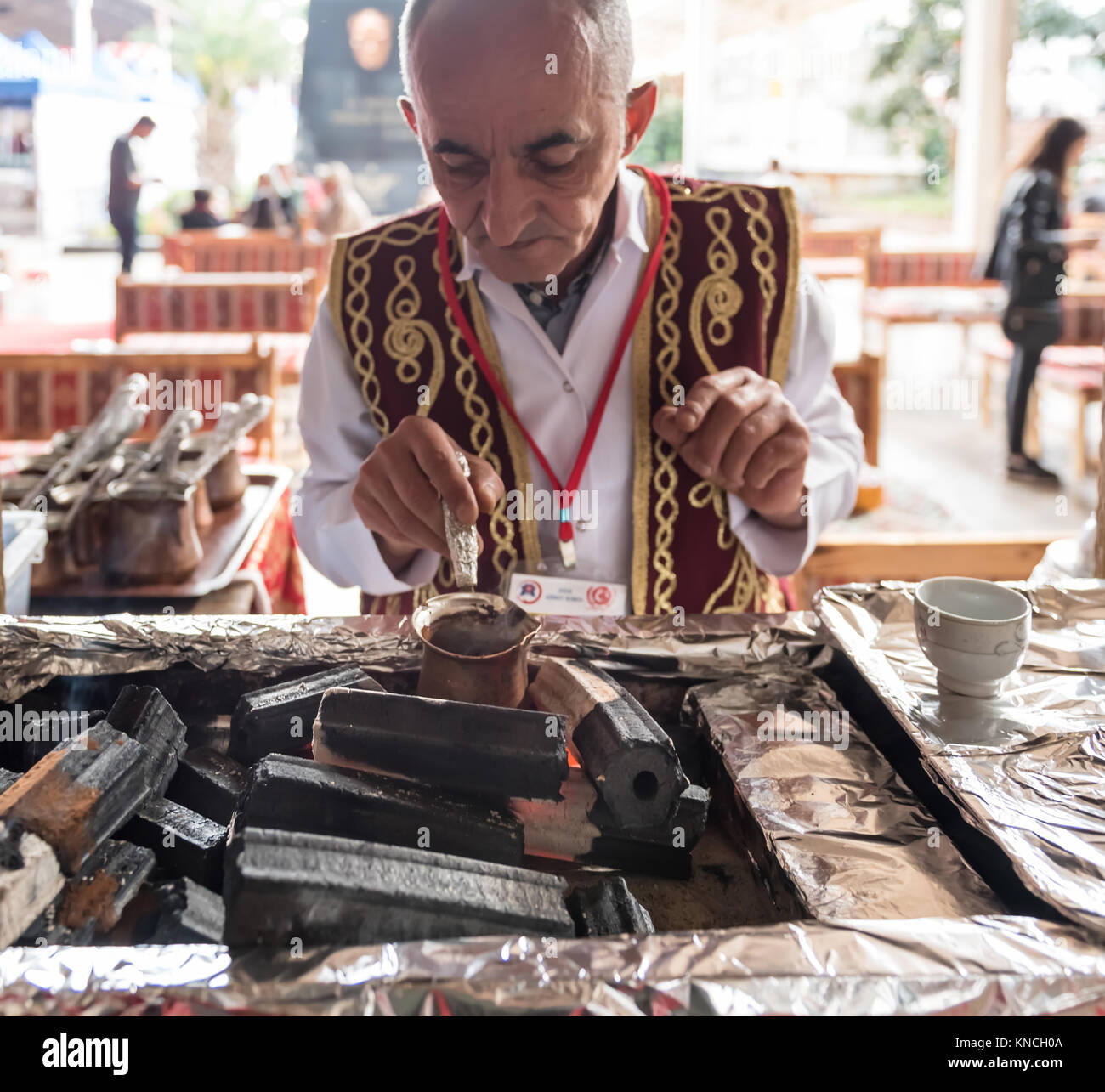 Unidentified Turkish man in a Small coffee shop cooks "Turkish Coffee ...