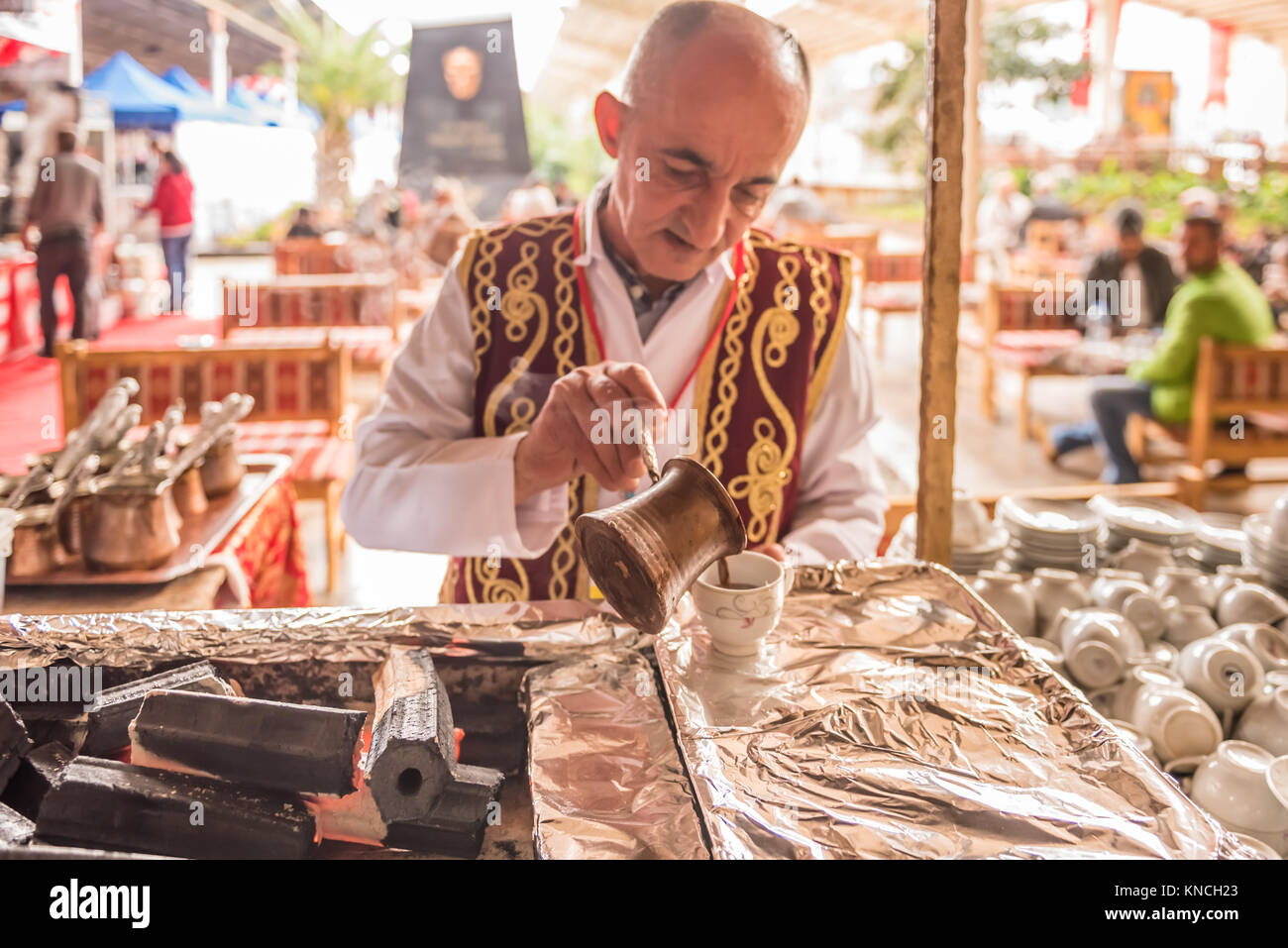 Unidentified Turkish man in a Small coffee shop cooks "Turkish Coffee ...