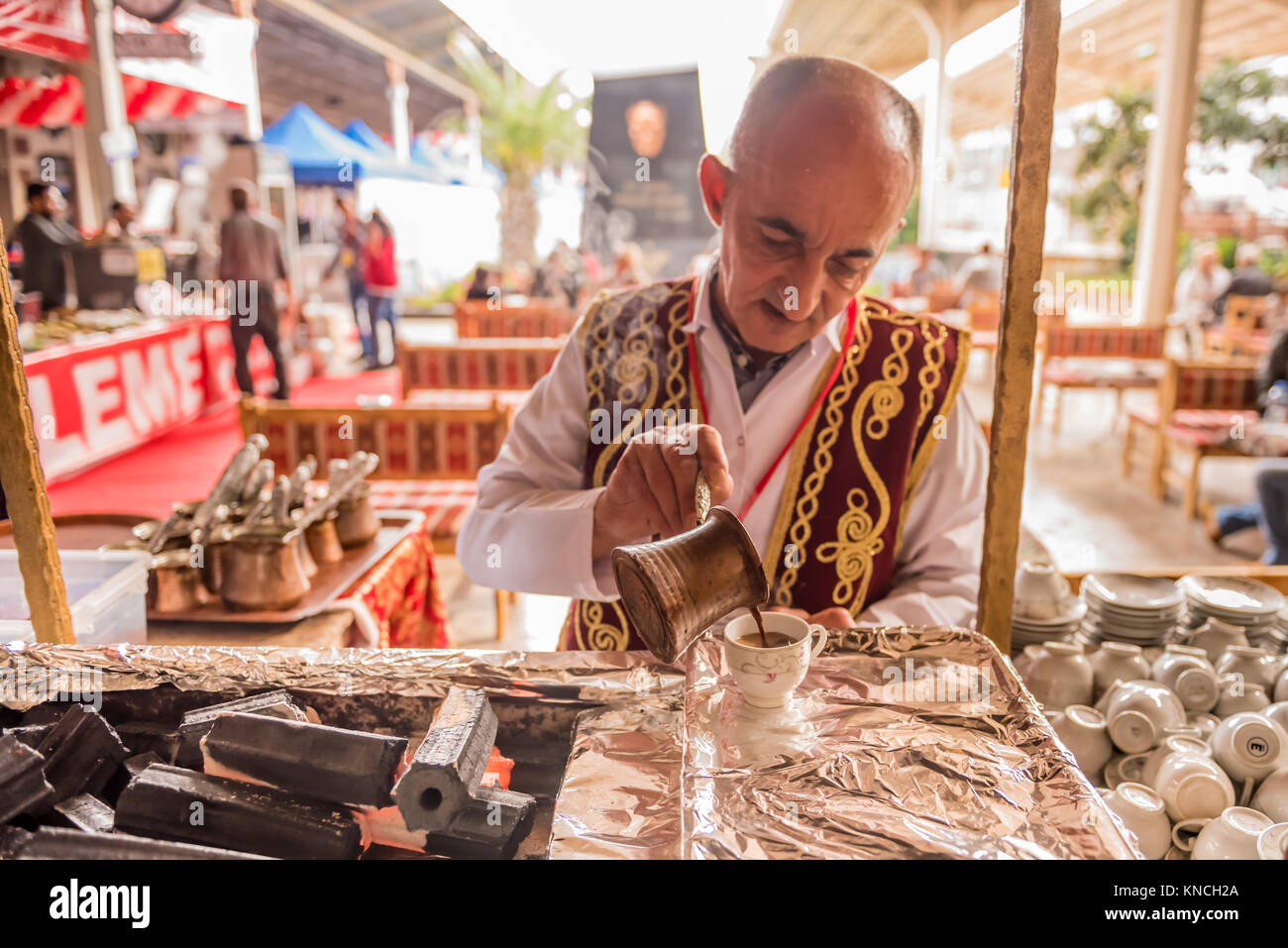 Unidentified Turkish man in a Small coffee shop cooks "Turkish Coffee ...