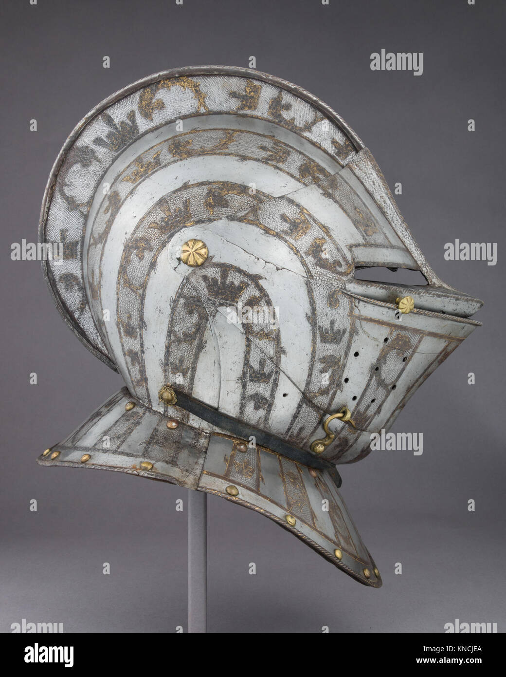 An armet helmet, another example of medieval armor, reflecting the ...