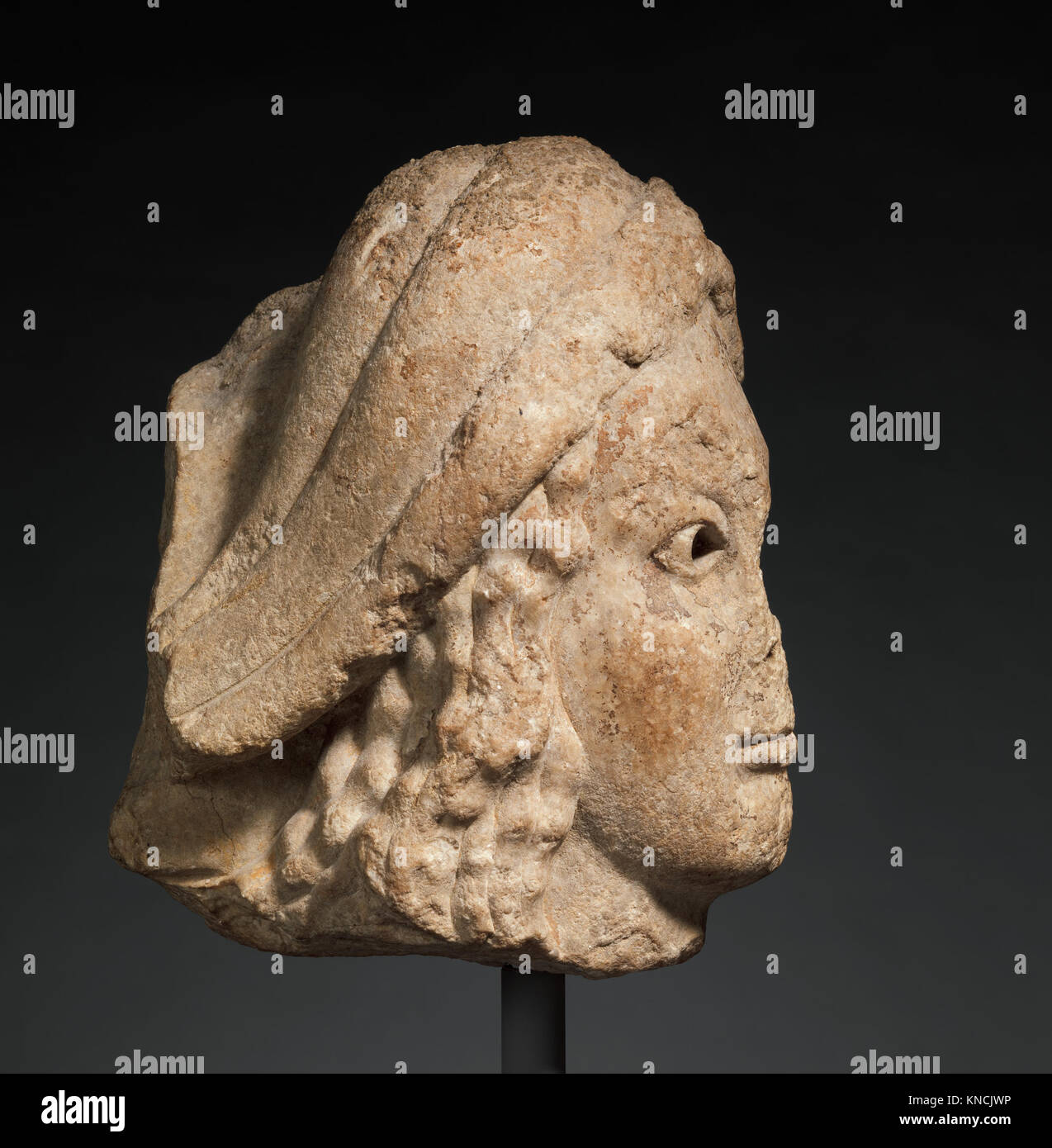 This head of a youth sculpture represents a classical portrayal of the ...