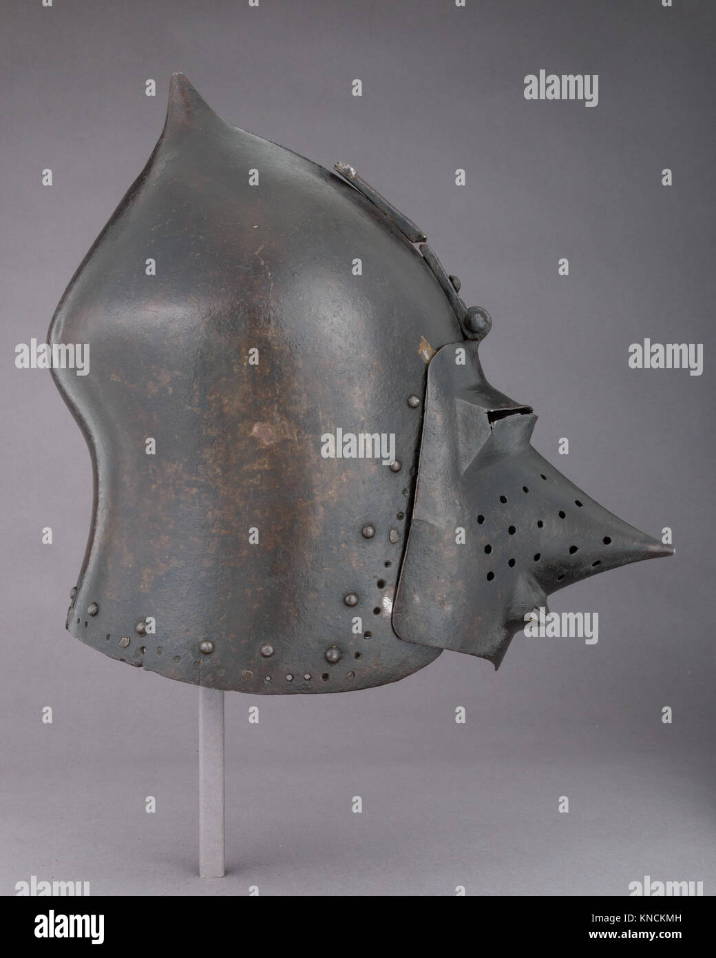 A basinet helmet, with a detachable visor, from the medieval period ...