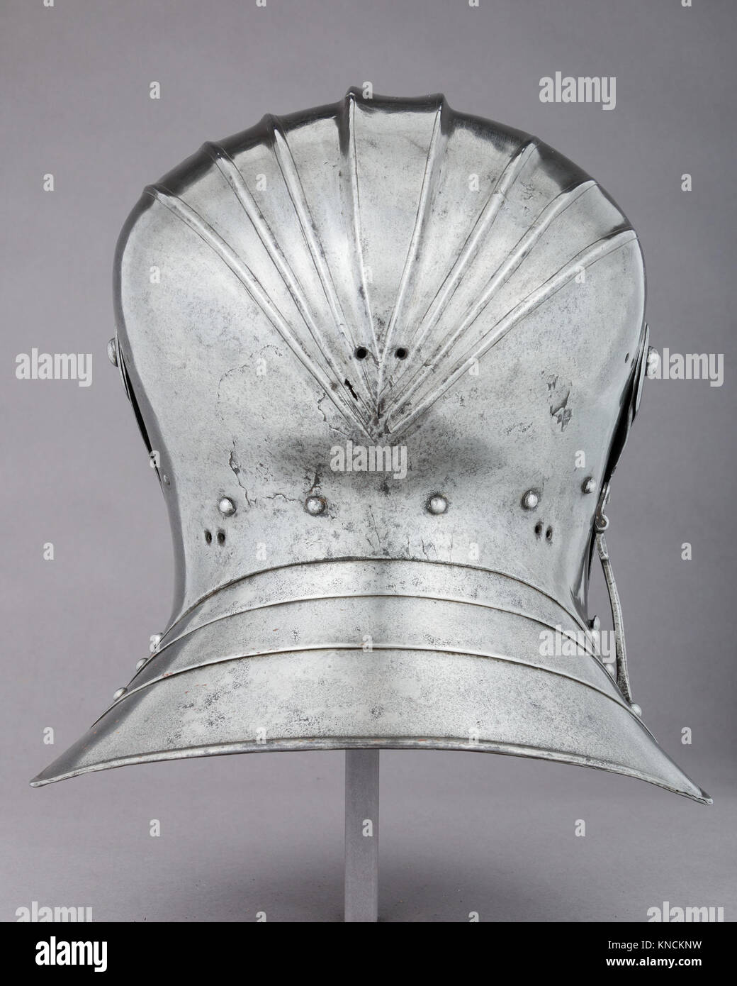This armet, a type of medieval helmet, features a fully enclosed design ...