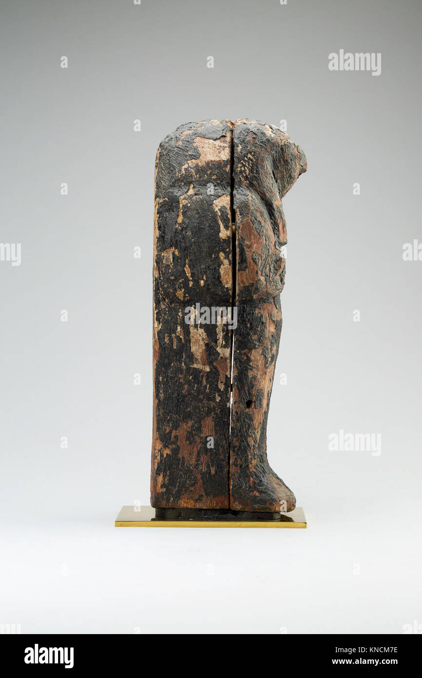 This canopic coffin, crafted in the shape of Qebehsenuef, one of the ...