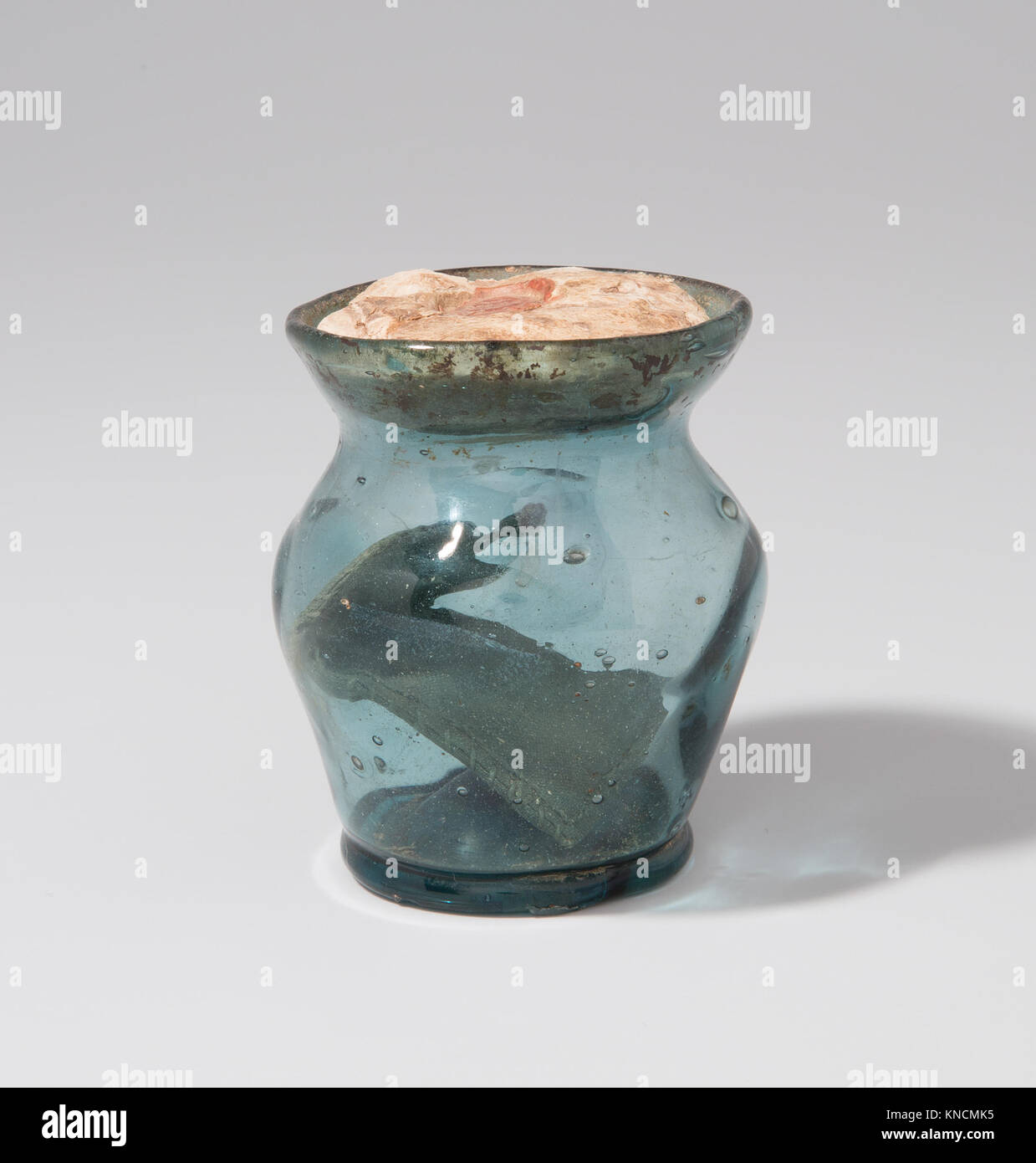 This glass reliquary, a sacred container, likely held religious relics ...