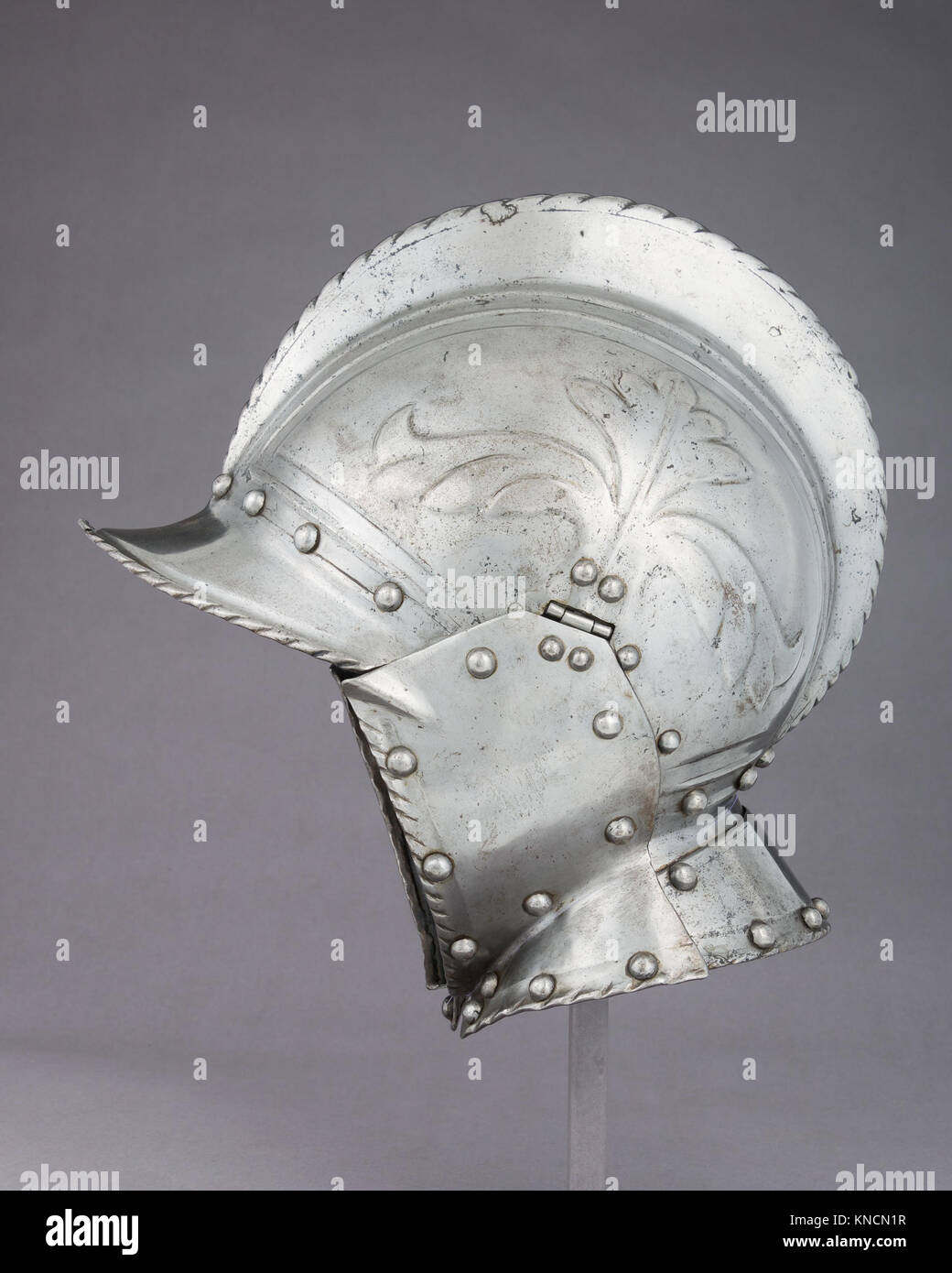 This burgonet, a type of medieval helmet, features a rounded shape and ...