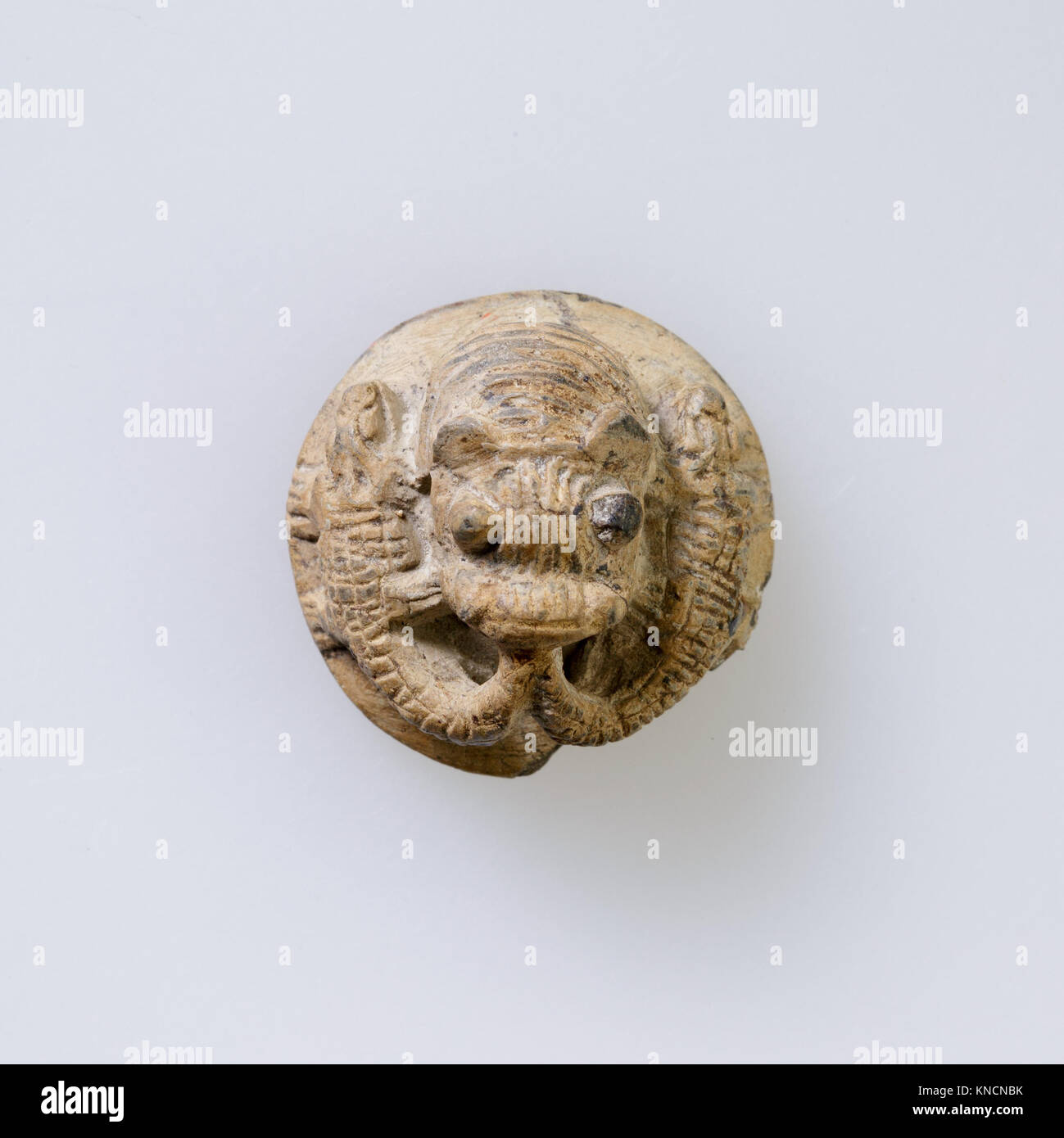 This ancient amulet features a hippopotamus-head design with four ...