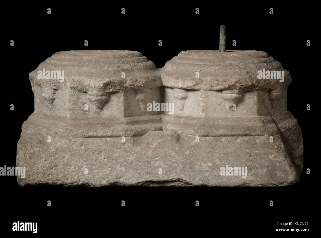 This double column base artifact illustrates classical architectural ...