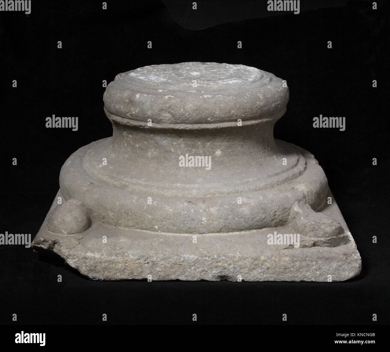 This column base demonstrates classical architectural design, featuring ...