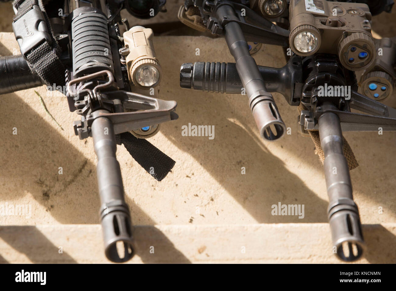 U.S. Marines stack weapons while they set up the range before an ...