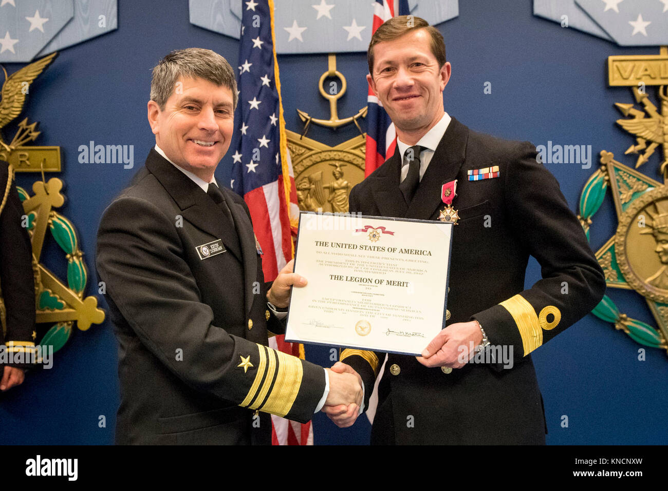 Director of Navy Staff, Vice Adm. Kevin Donegan, presents the Legion of ...