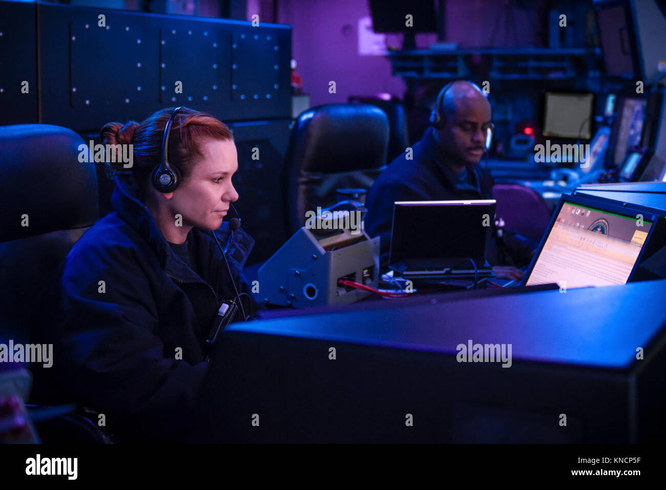 Chief Intelligence Specialist Kelly McGinnis, left, and Cmdr. Kenny ...