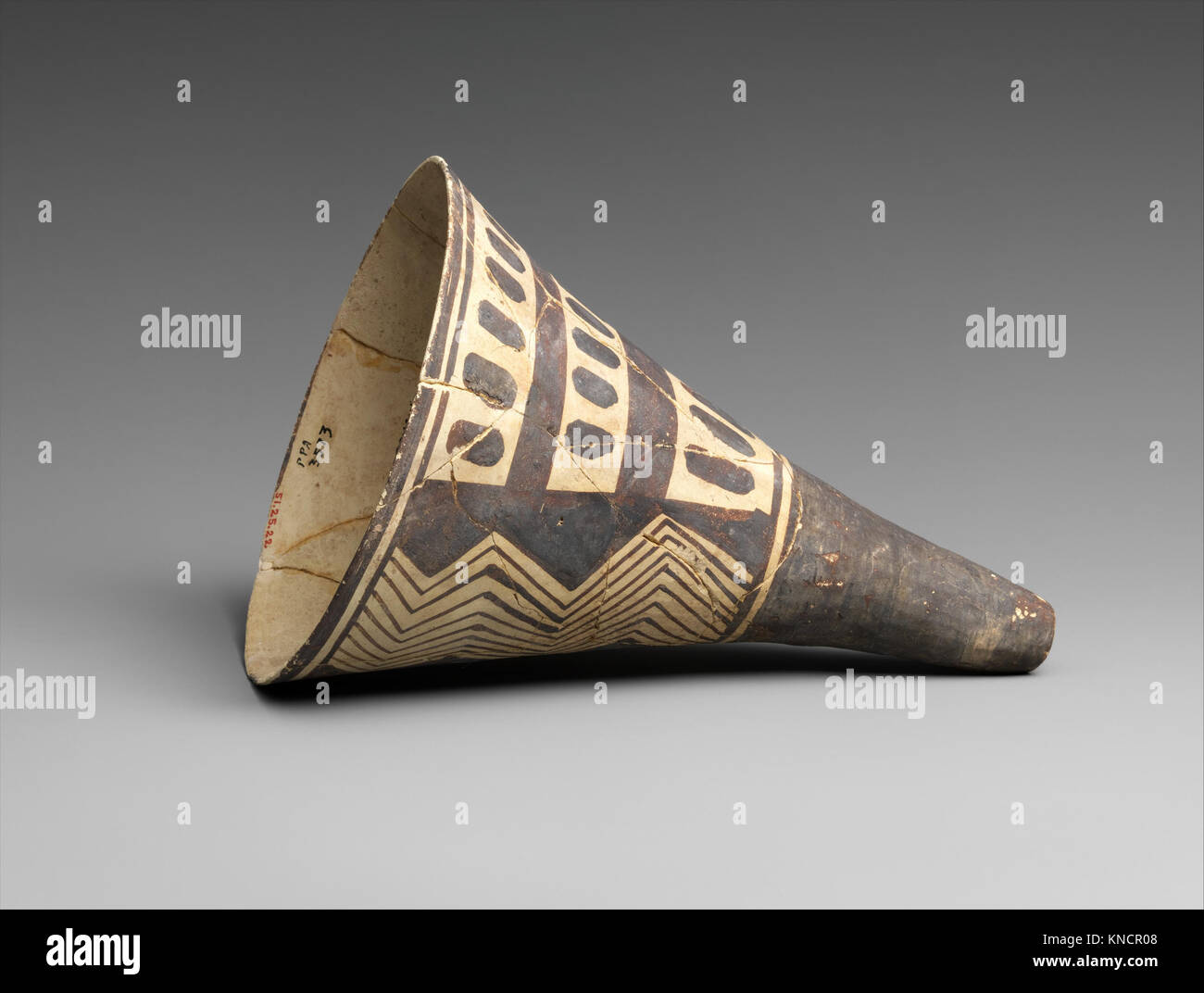 A cone-shaped vase featuring geometric decoration, part of The ...