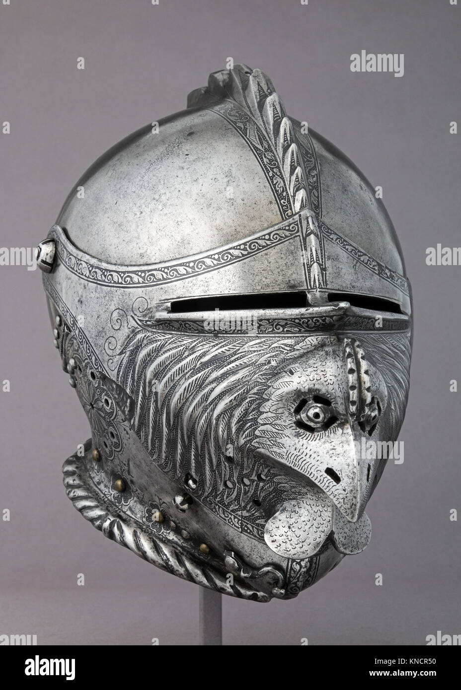 This armet helmet has a rooster-shaped mask visor and demonstrates both ...