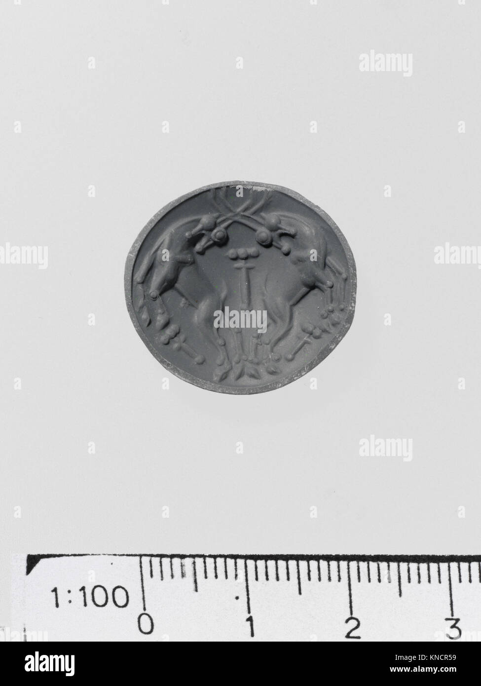 A lentoid seal made from agate, used for stamping or indicating ...