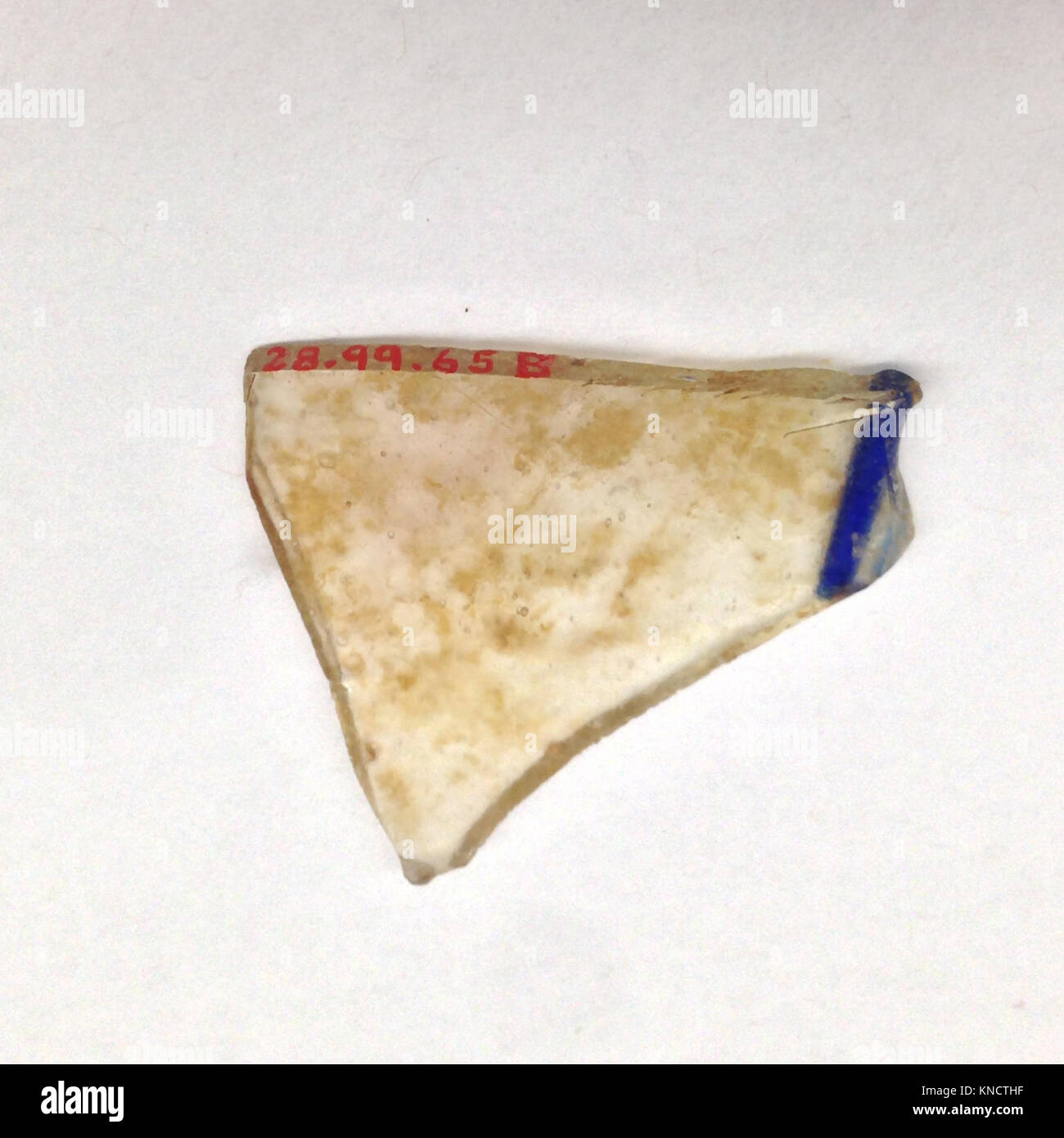 This glass fragment, possibly from a larger vessel, represents the ...