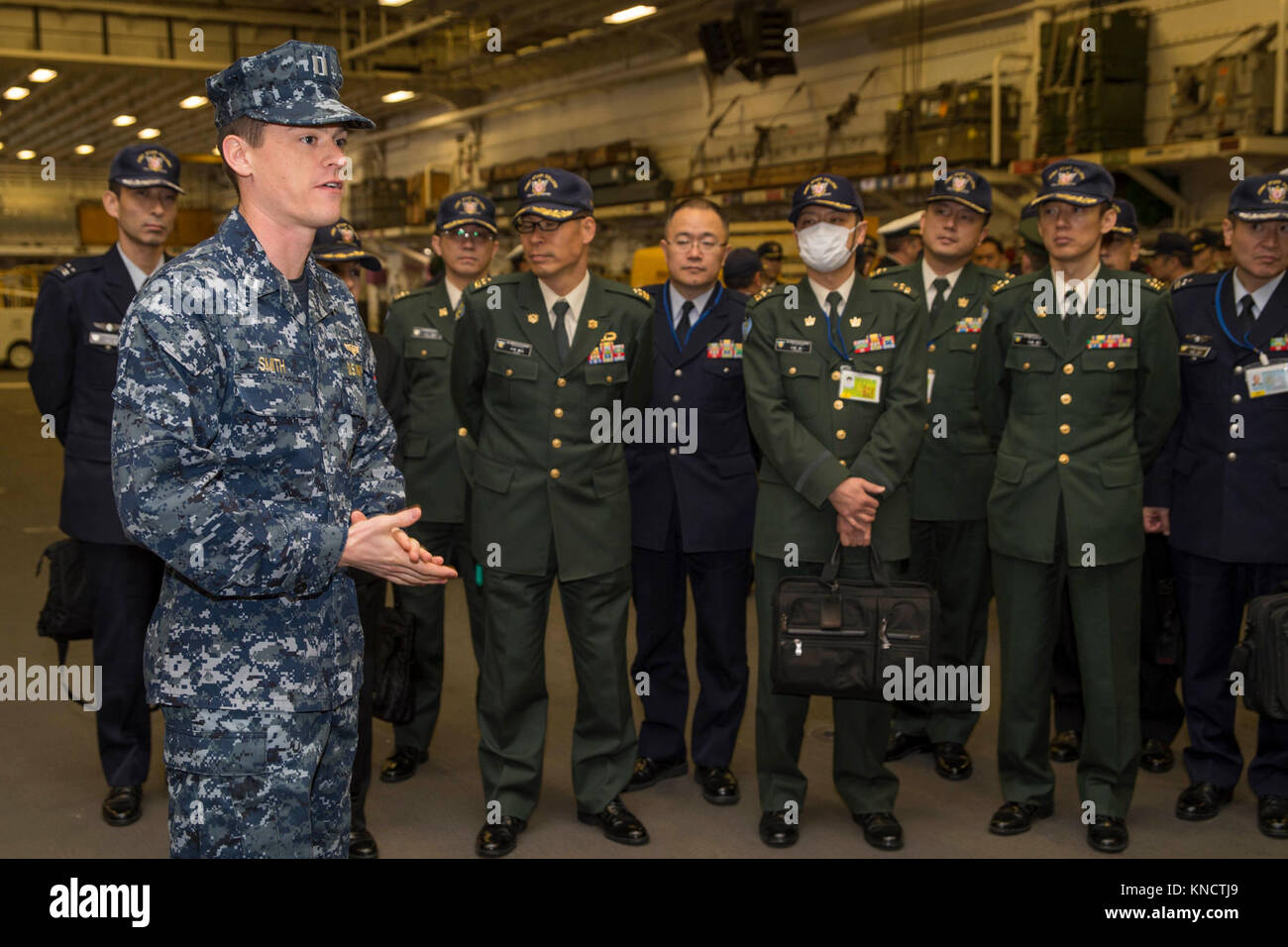 Lt. Reed Smith, left, a hangar deck officer aboard the amphibious ...