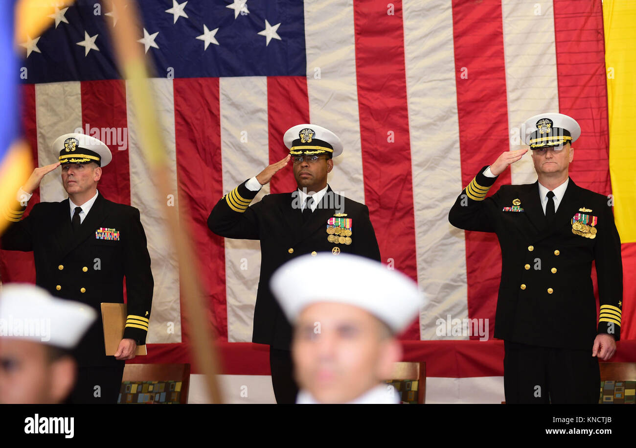 Capt. Charlos Washington, center, prospective commanding officer of ...
