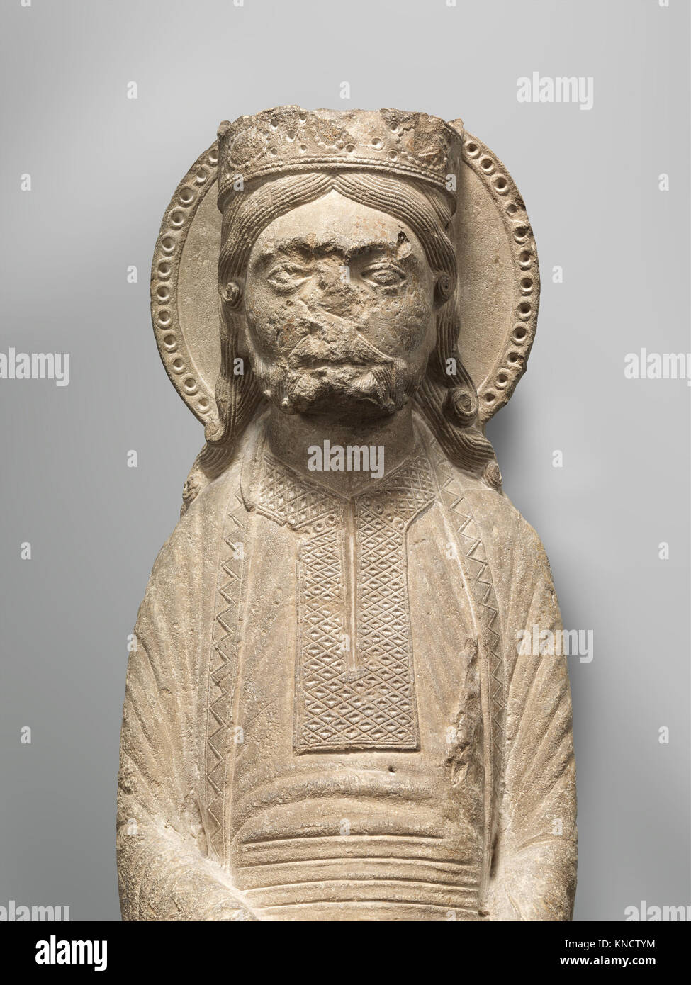 This column statue depicts a king with detailed carvings, illustrating ...