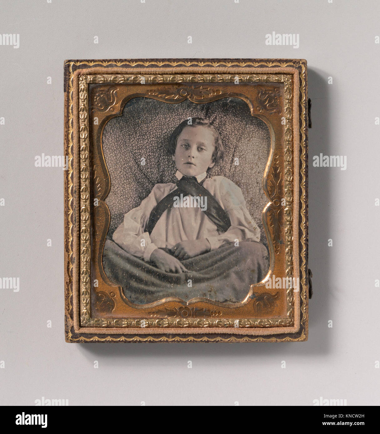 An artwork showing a boy seated cross-legged, partially covered by a ...