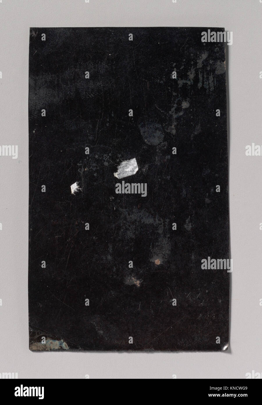 This artwork depicts a tinsmith working with a coal heater and a sheet ...