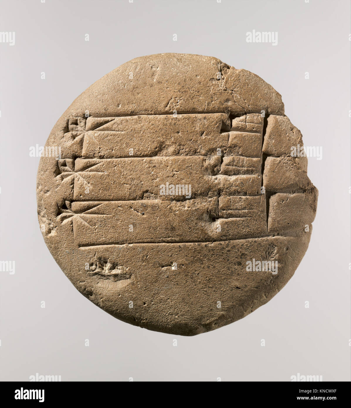 A cuneiform tablet, likely a student exercise, showing early writing ...