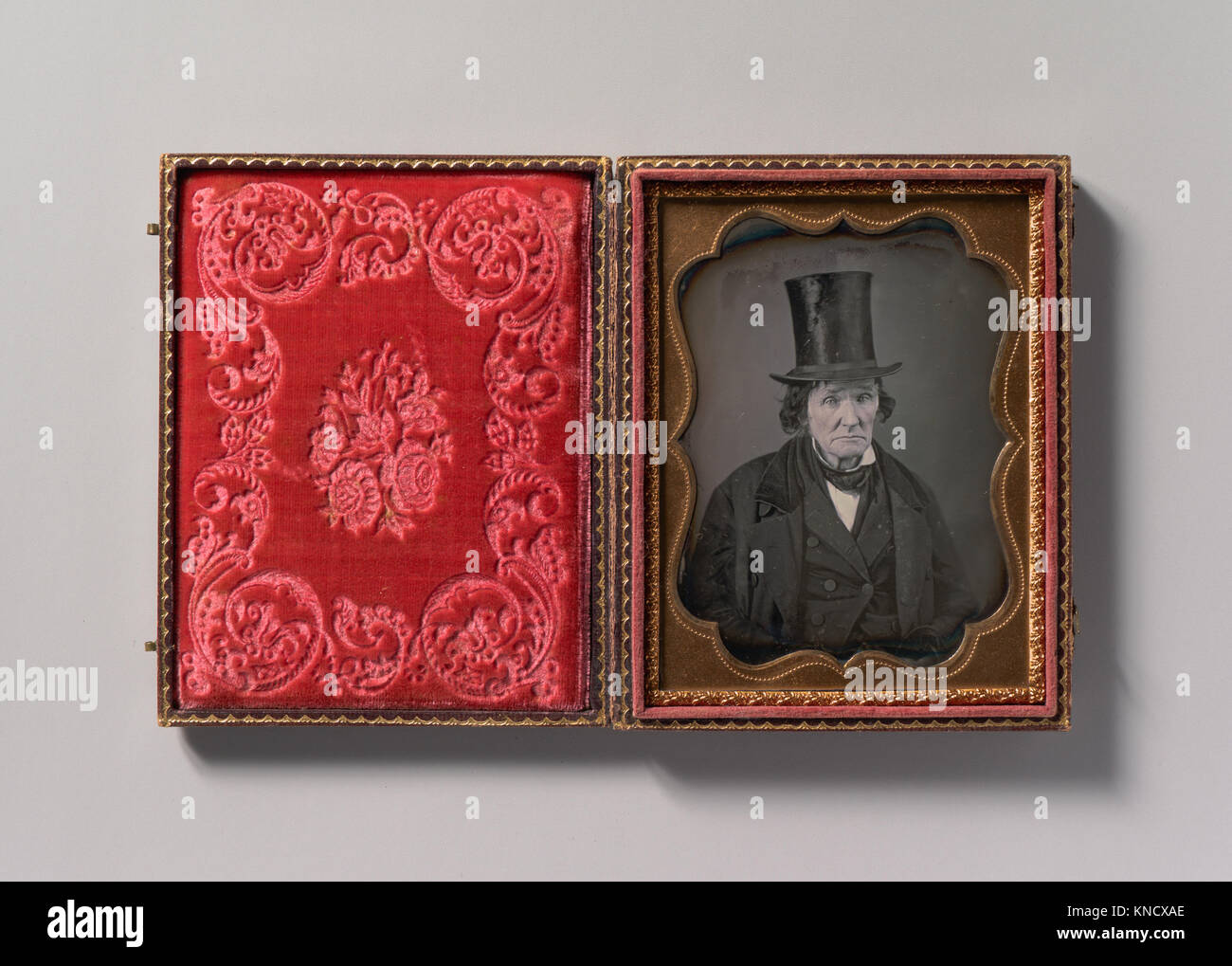 This portrait depicts an older man dressed in formal attire, including ...