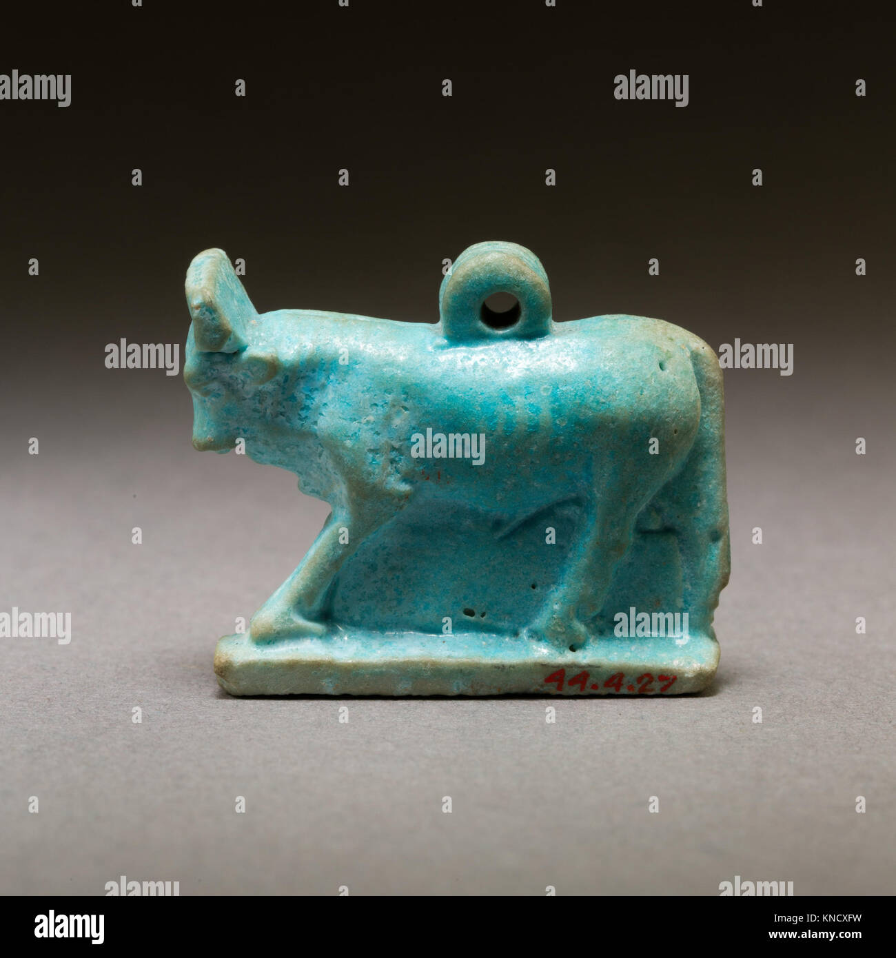 This bull-shaped amulet symbolizes strength and protection, reflecting ...