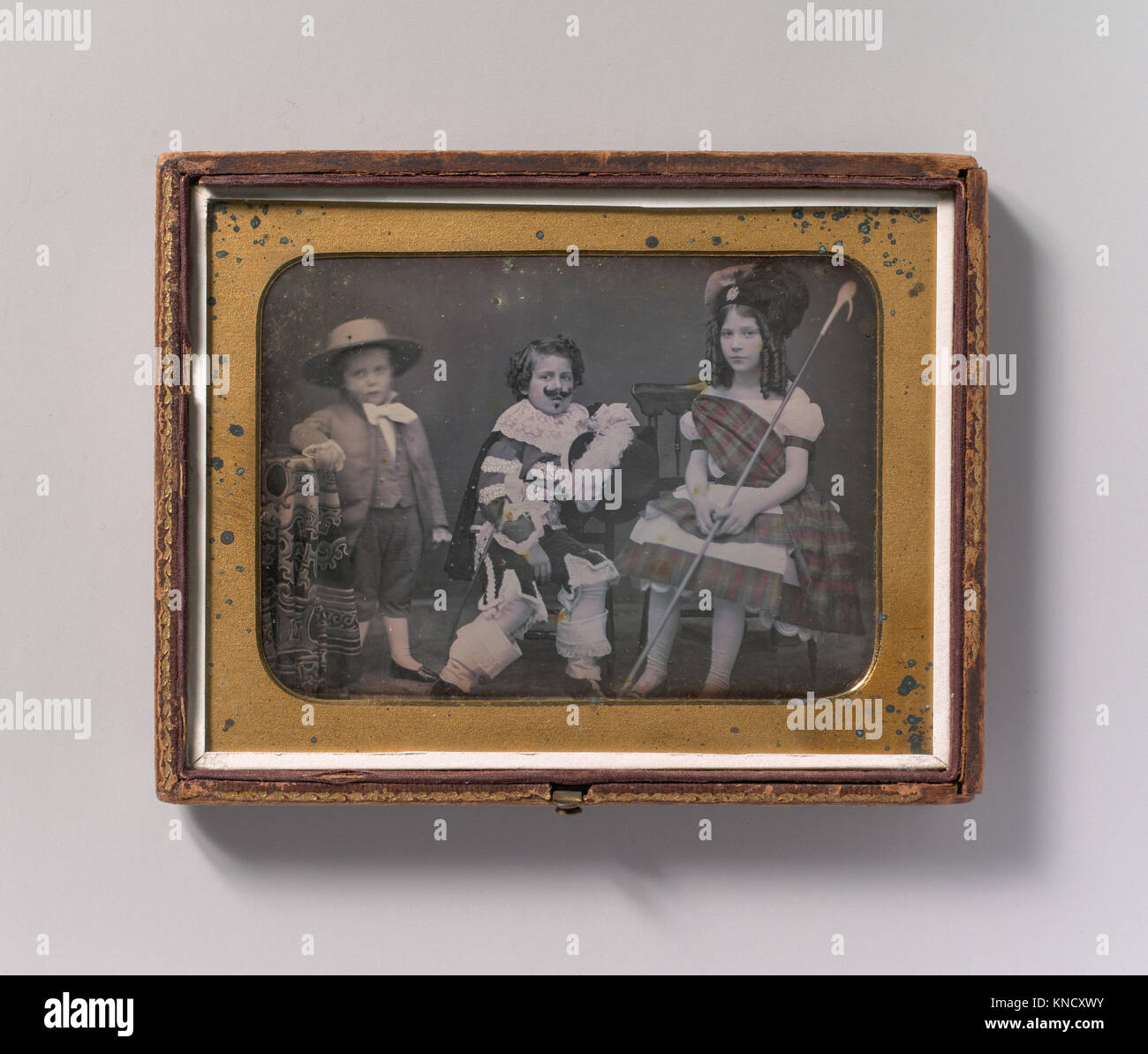 This artwork features three children dressed in period costume ...