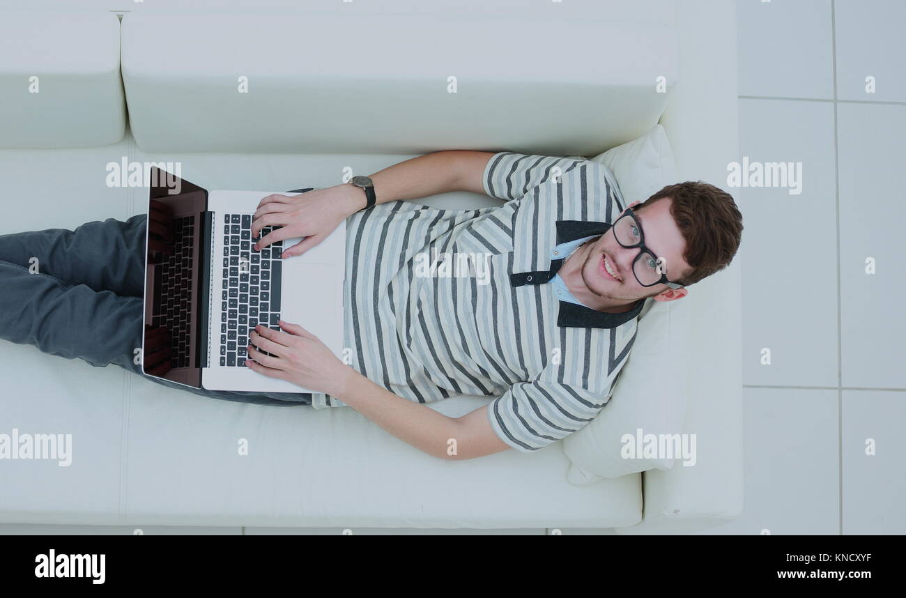 Young man using his laptop, close up Stock Photo - Alamy