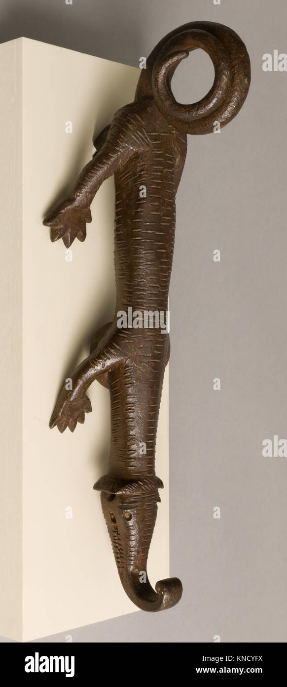 Door knocker designed as a lizard-like creature, illustrating ...