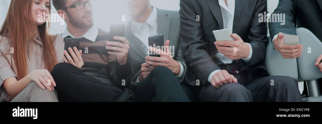 Group of young people use their phones Stock Photo - Alamy