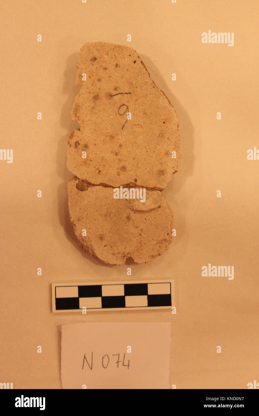 This fragment represents a small piece of a larger object, offering ...