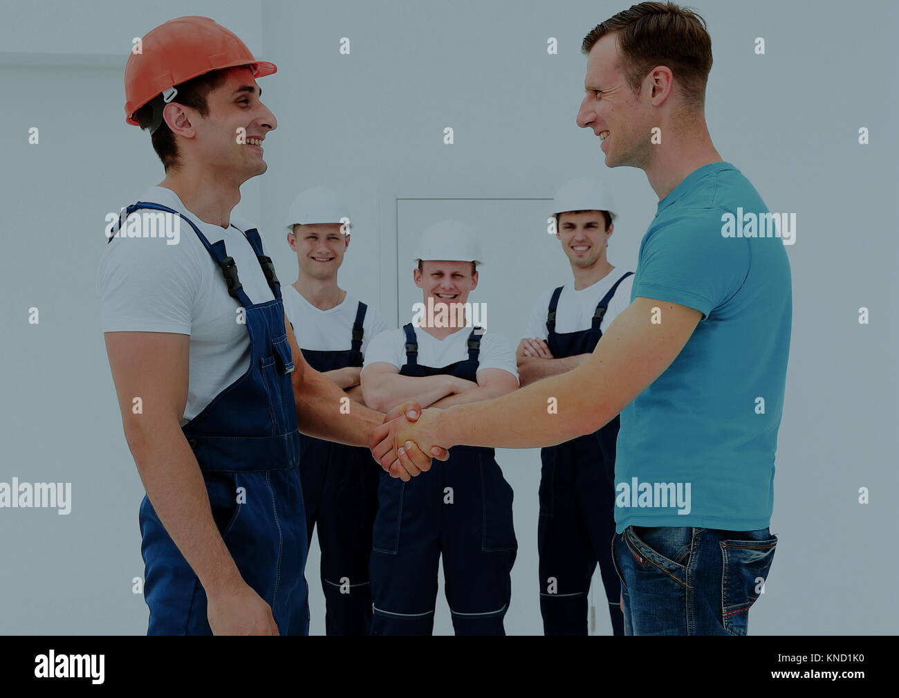 Customer Shaking Hands With Builder Stock Photo - Alamy