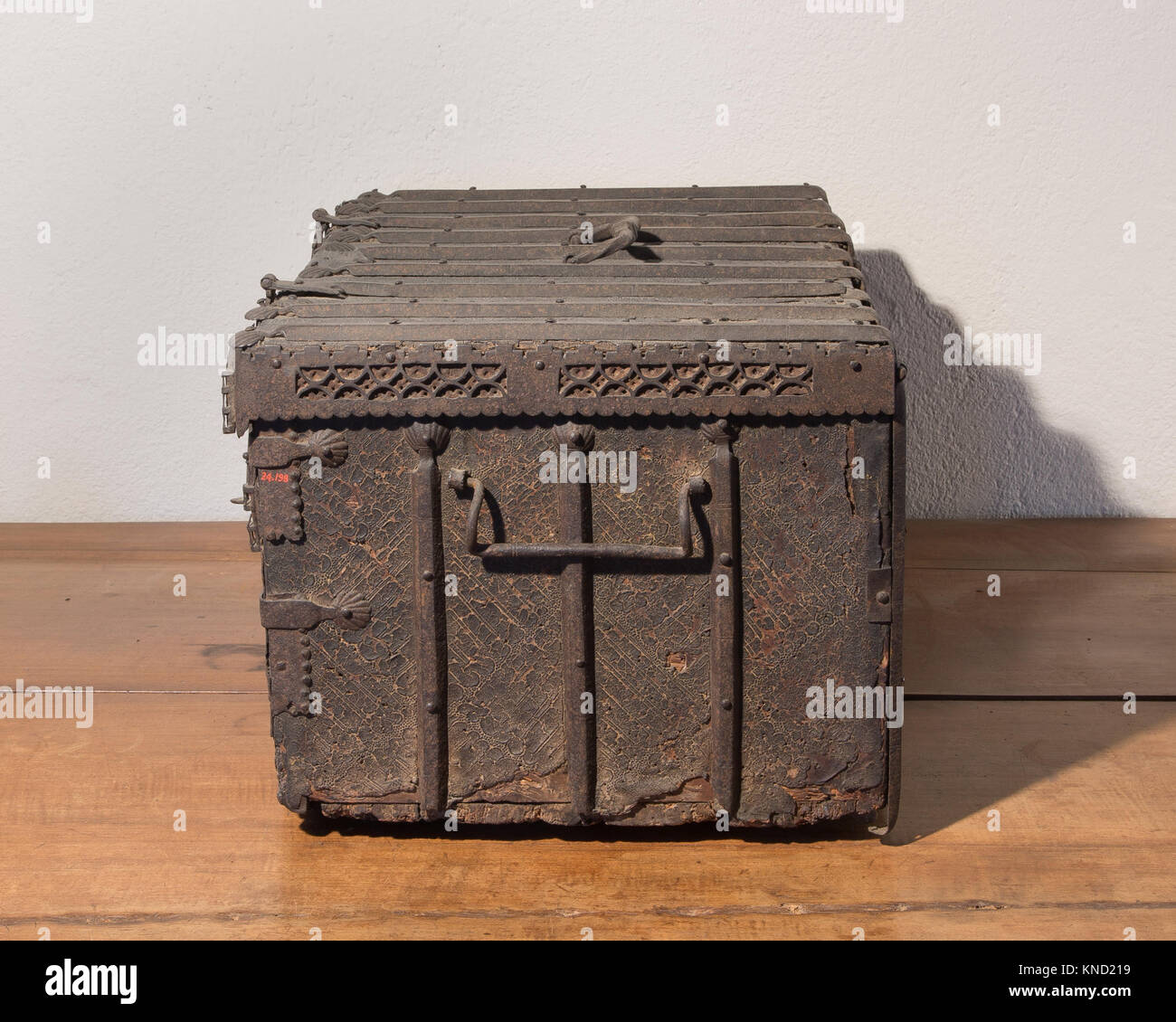 This coffer is a storage container, typically used to hold valuables or ...