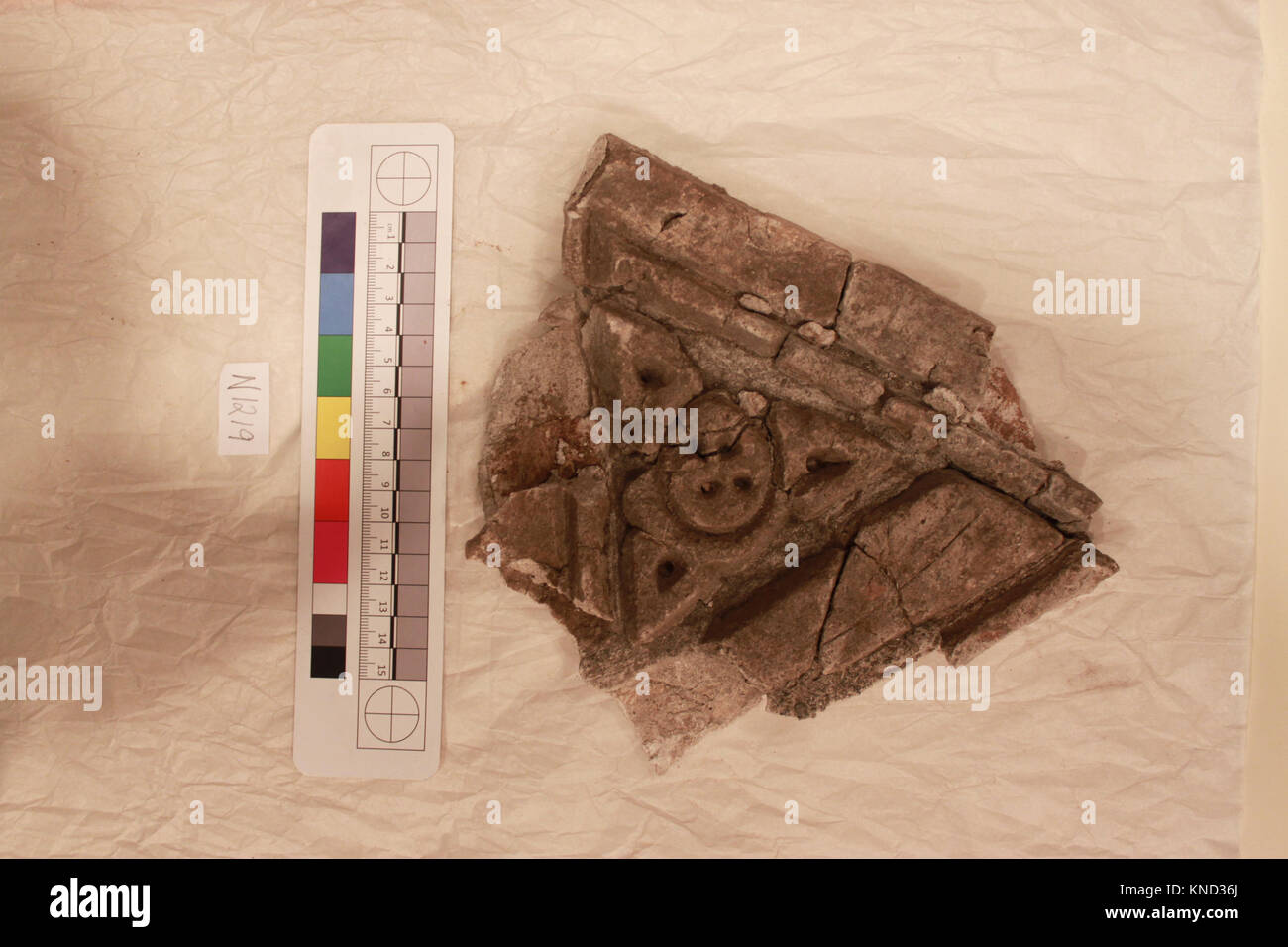 This fragment, part of a larger object, shows evidence of its original ...