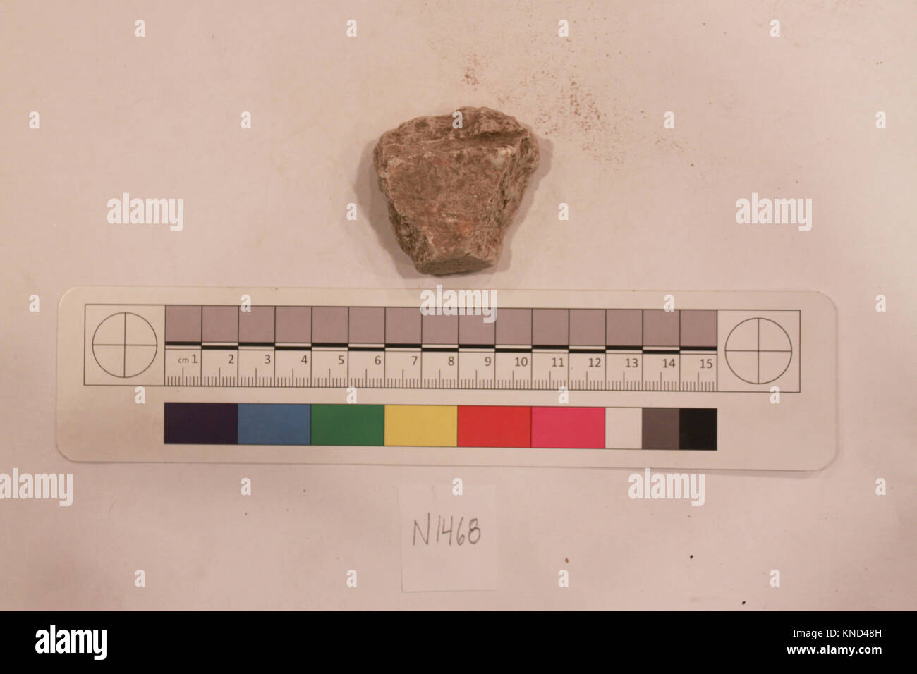 This fragment, part of a larger object, shows ancient stucco or ceramic ...