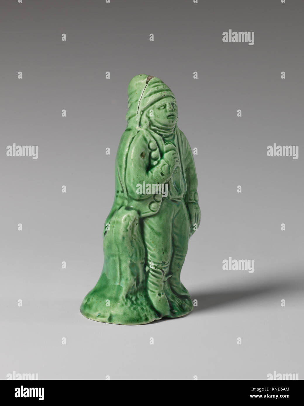 This figure represents a standing male, likely from an ancient culture ...