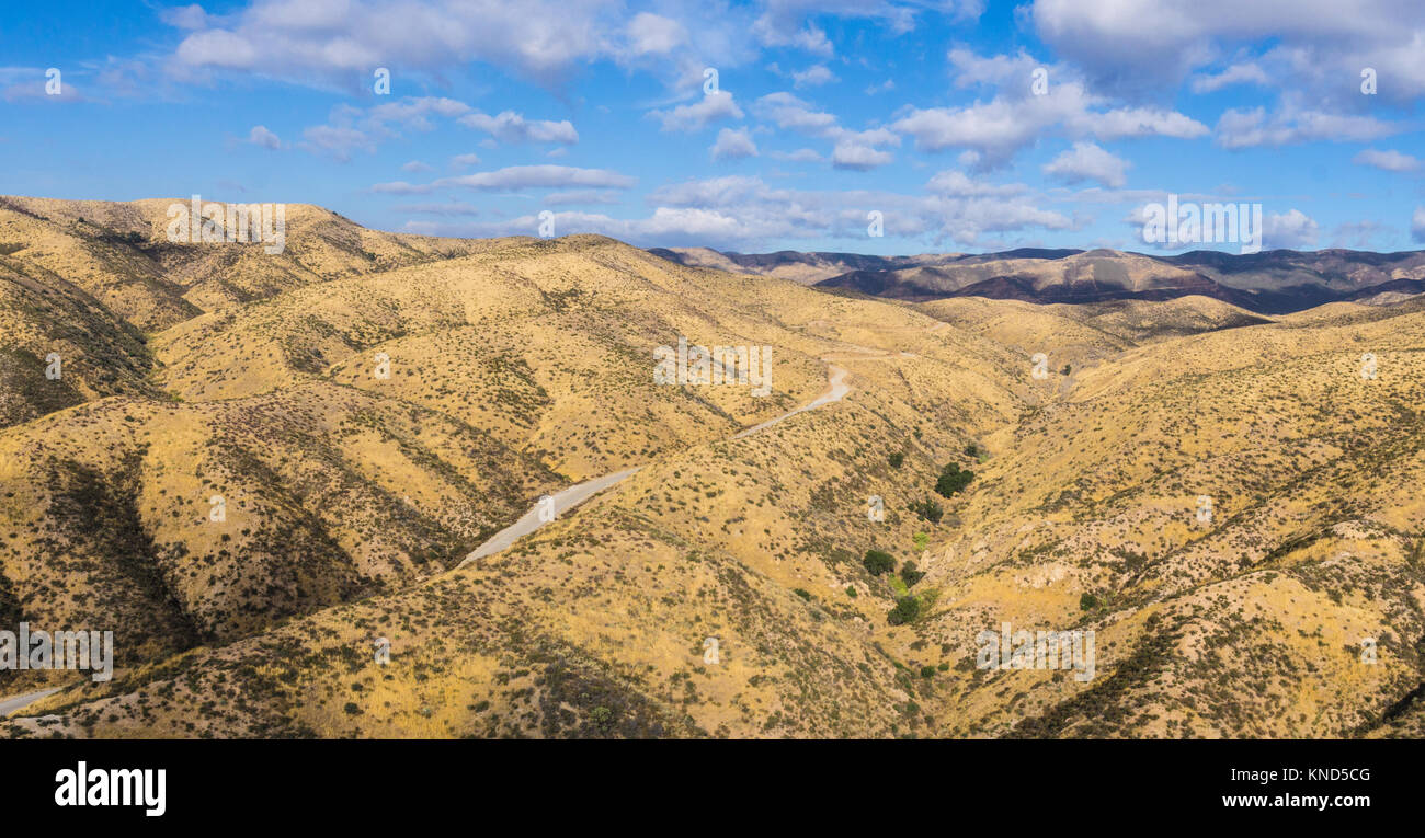 Panorama of road through rolling hills of southern California's Angeles ...