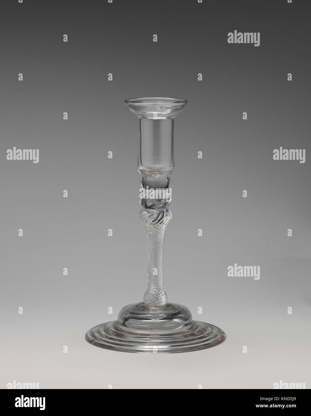 This candlestick, part of a matching pair, is a fine example of 18th ...