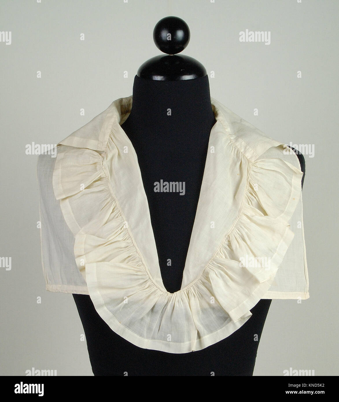 This chemisette, a 19th-century garment, features delicate lace and ...