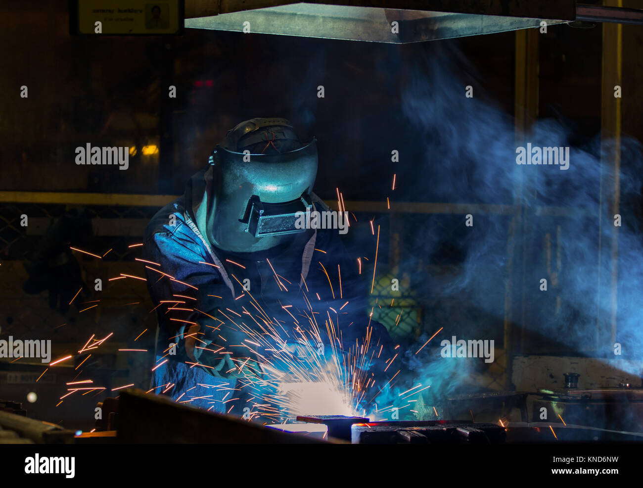 Industrial worker is welding in factory Stock Photo - Alamy